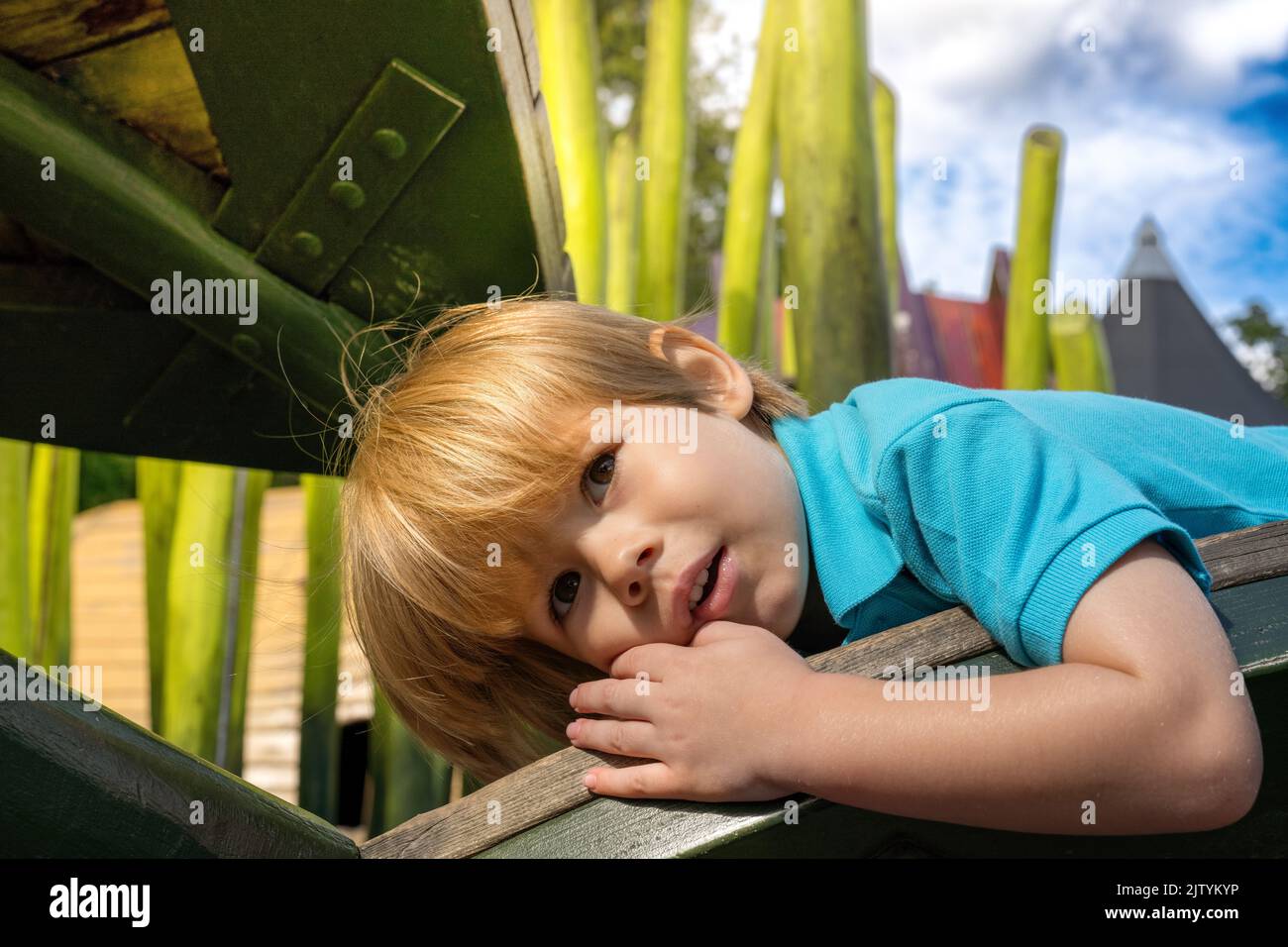 Adorable caucasian boy smiling happy playing at the park Stock Photo - Alamy
