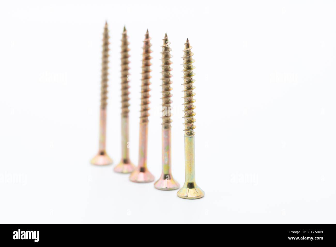Screws in a close up from the side, wood screws, white background ...