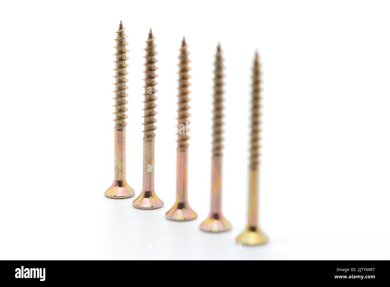 Screws in a close up from the side, wood screws, white background ...