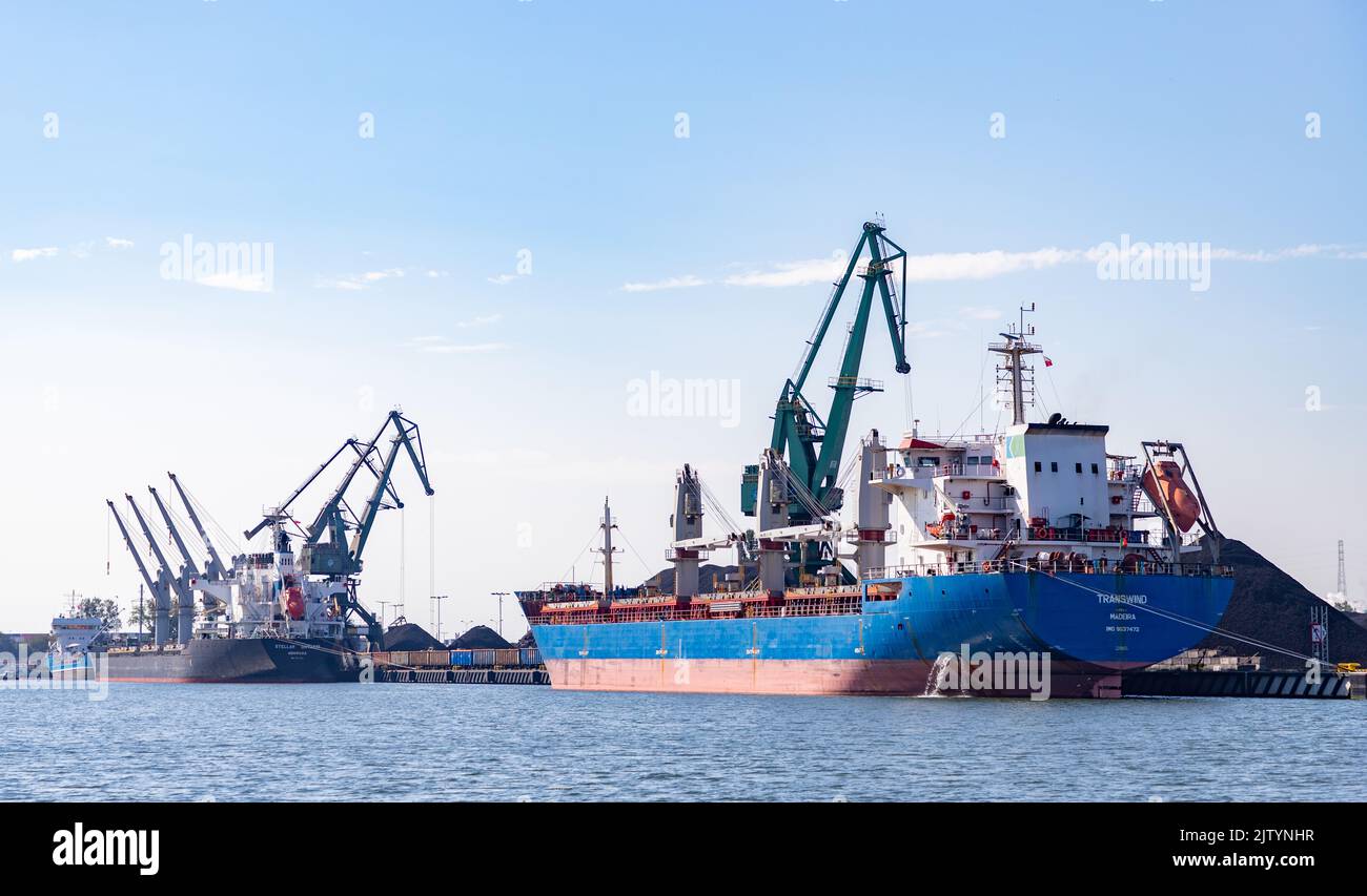 A picture of a cargo ship and a bulk carrier in the Gdansk Shipyard ...