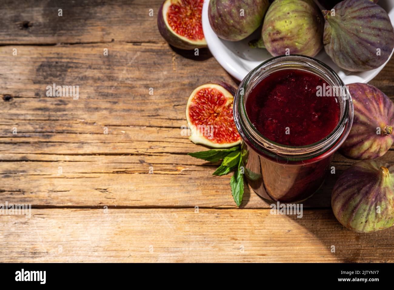 Red fig jam in small jar. Homemade autumn fig jam with fresh fruits ...