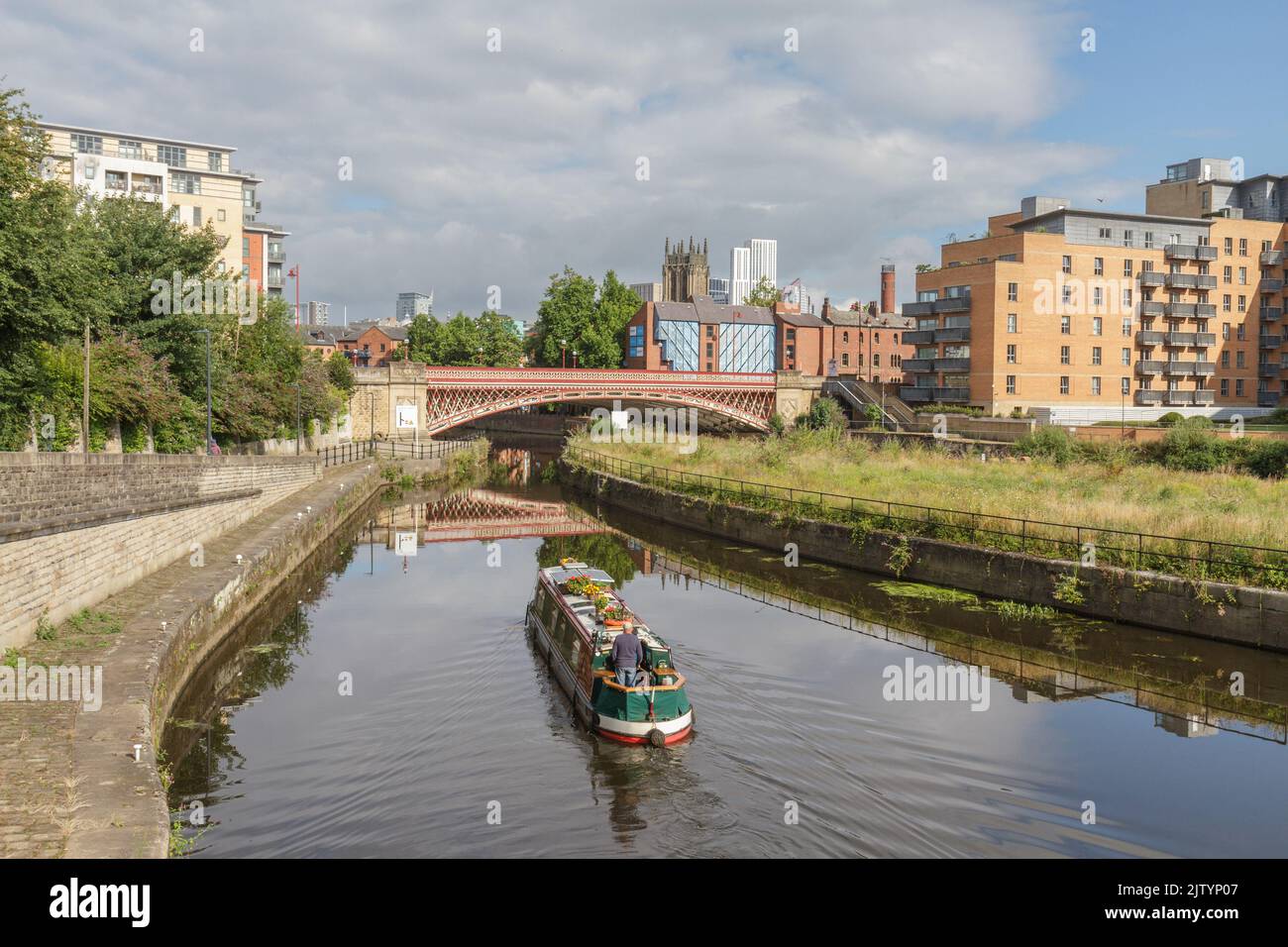 Canal boat leaving Leeds Dock, heading towards the Crown Point Bridge ...