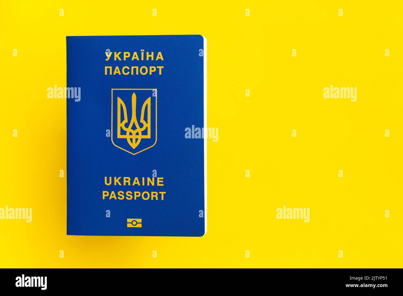 Ukrainian international biometric passport on yellow background Stock ...