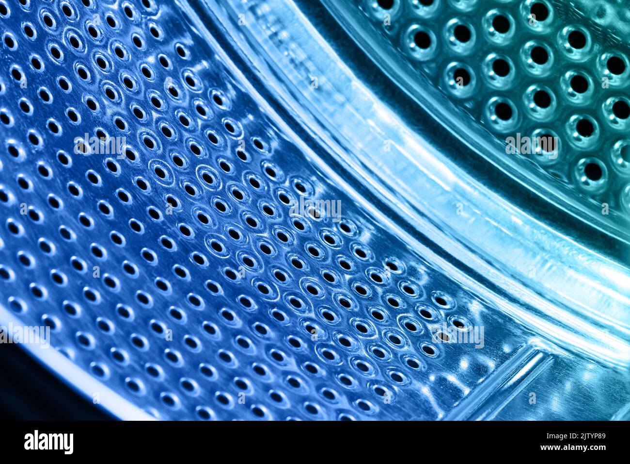 Close-up of inside of a steel washing machine drum Stock Photo - Alamy