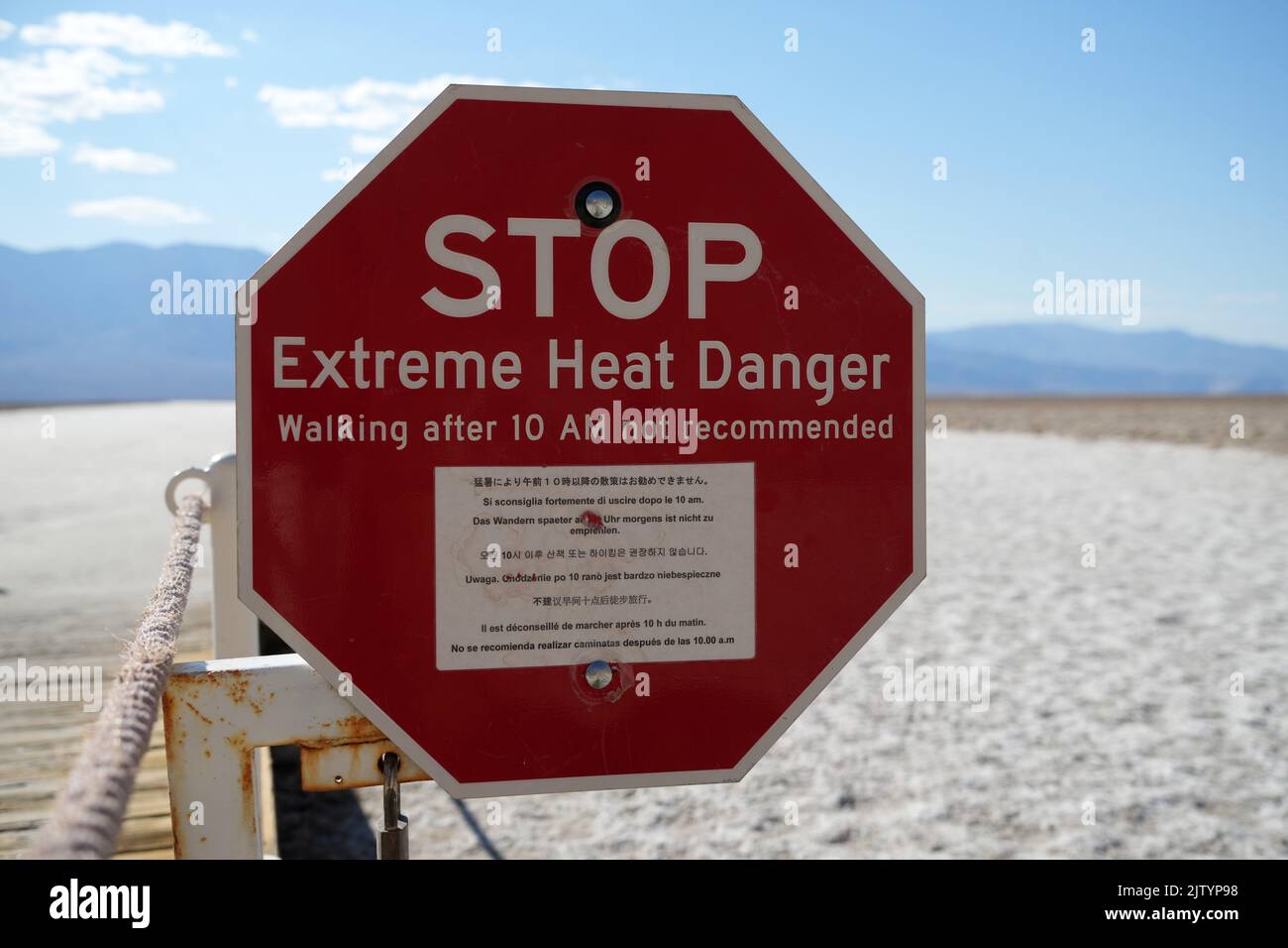 A stop sign warns of extreme heat danger in Badwater Basin, Thursday ...