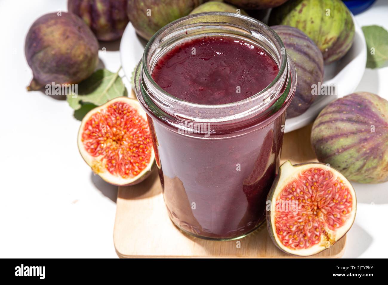 Red fig jam in small jar. Homemade autumn fig jam with fresh fruits ...