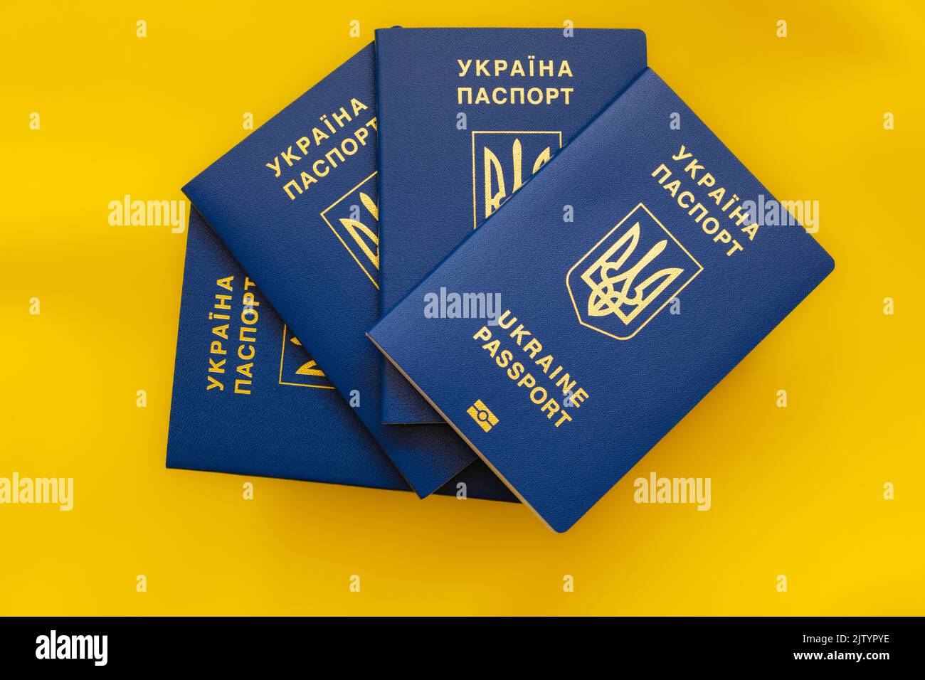 Ukrainian international biometric passport on yellow background Stock ...