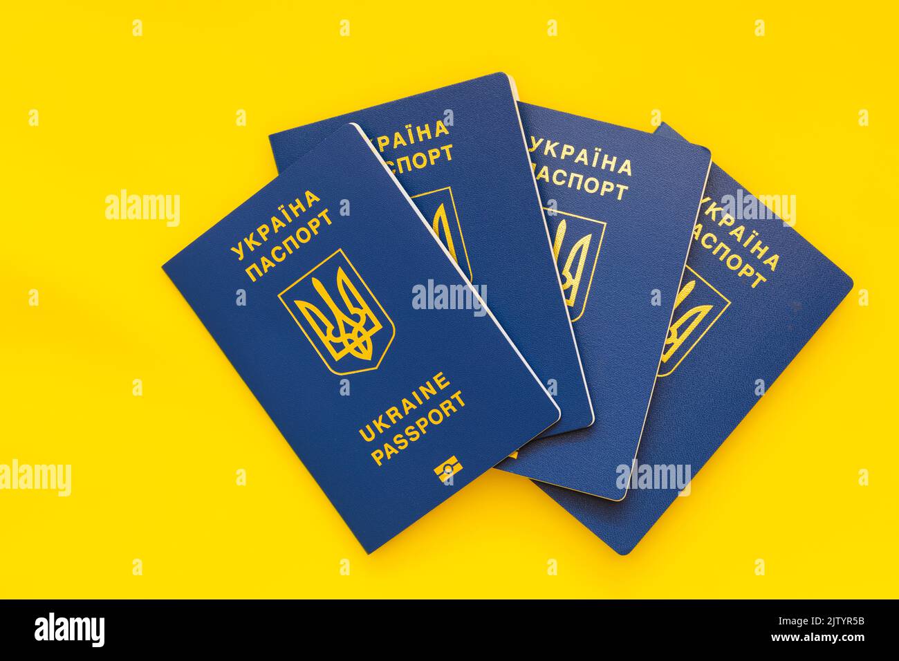 Ukrainian international biometric passport on yellow background Stock ...