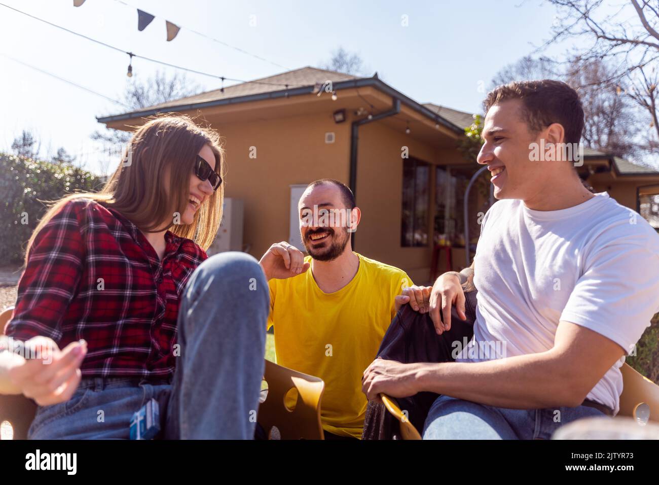 Three female friends laughing playing hi-res stock photography and ...