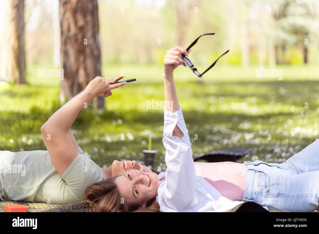 Stylish group of people enjoying in beautiful summer time while ...