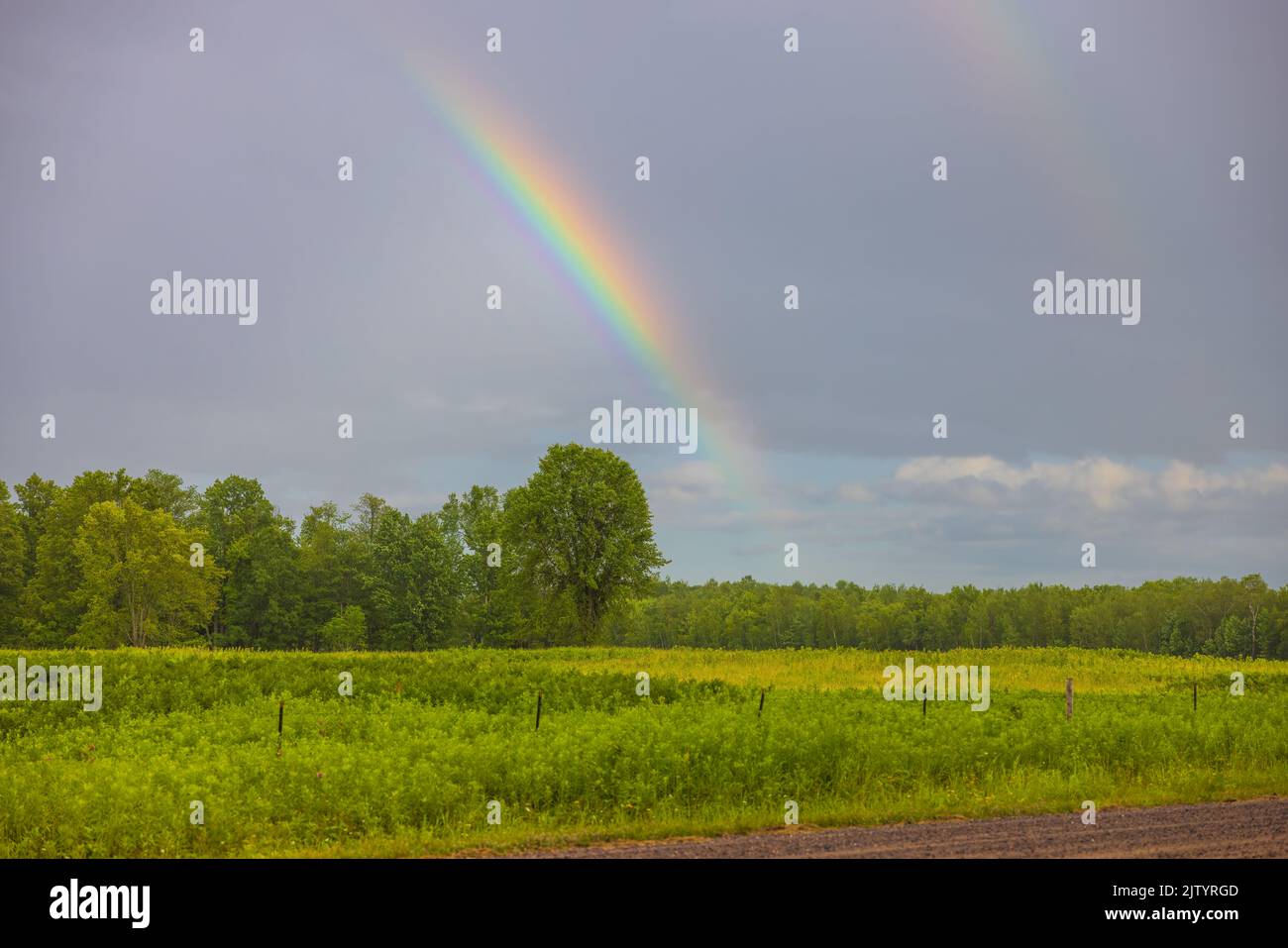 Rainbow over dirt road hi-res stock photography and images - Alamy
