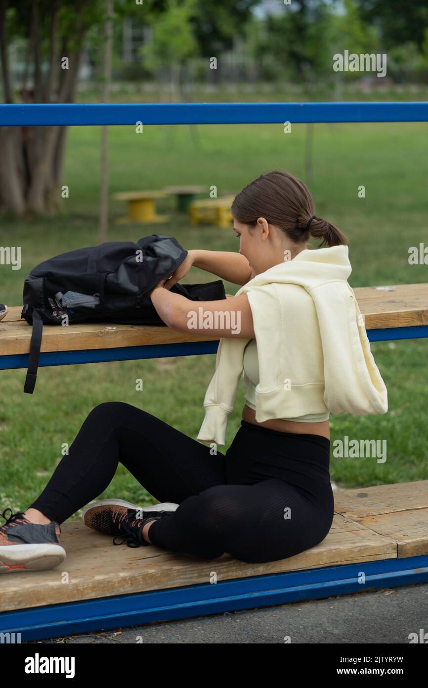 Two girls are taking a break before leaving and finish their training ...