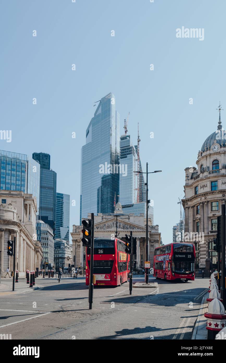 London, UK - August 26, 2022: Red double decker buses on a road by the ...