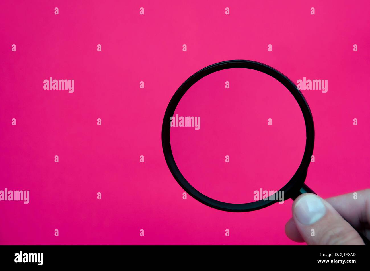 Hand holding magnifying glass with space customizable for text or ideas ...