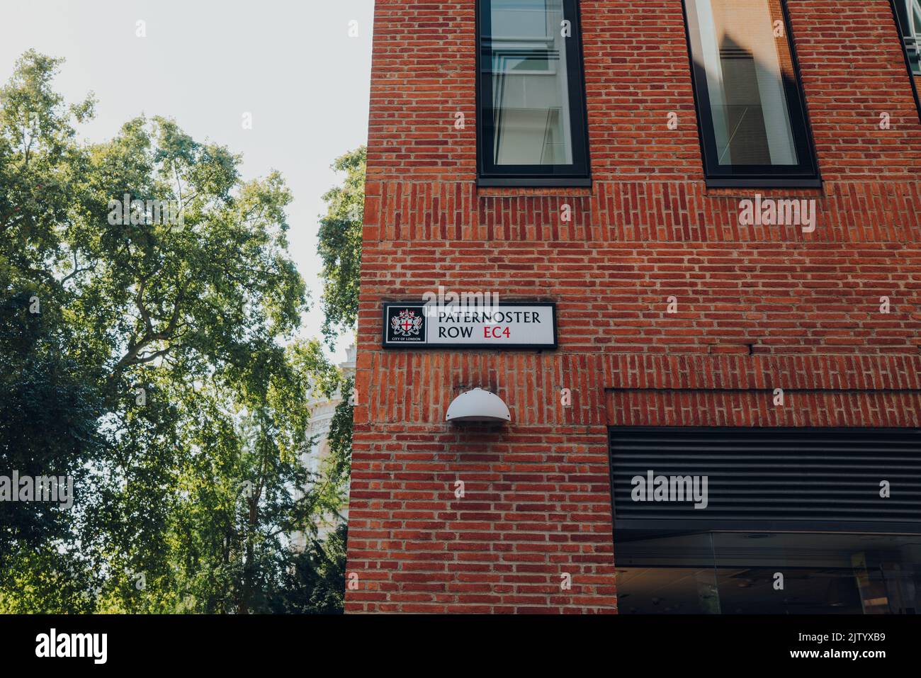 London, UK - August 26, 2022: Low angle view of a street name sign on a ...