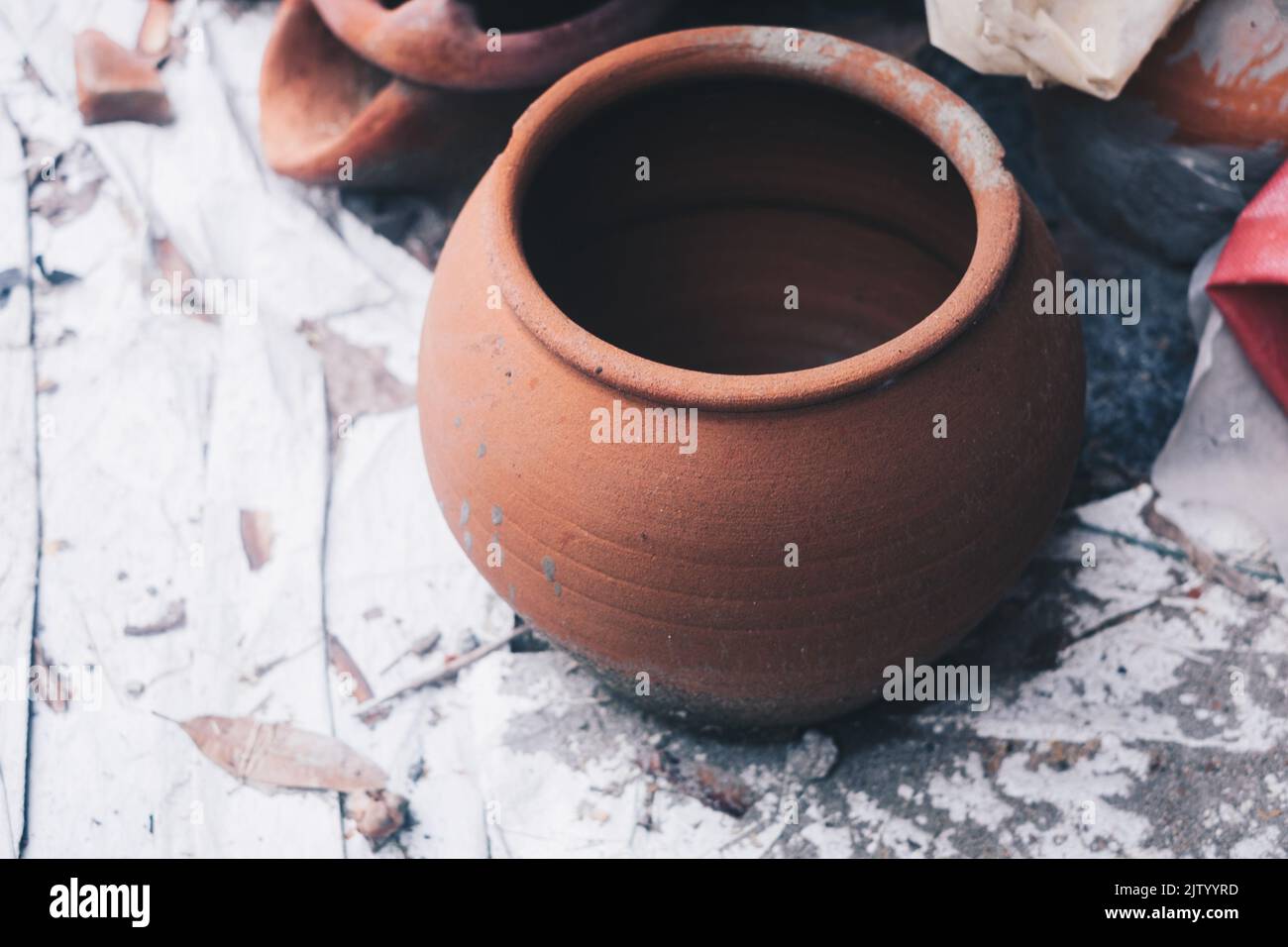 Closeup of newly made large unglazed clay pot jar - can be used as ...