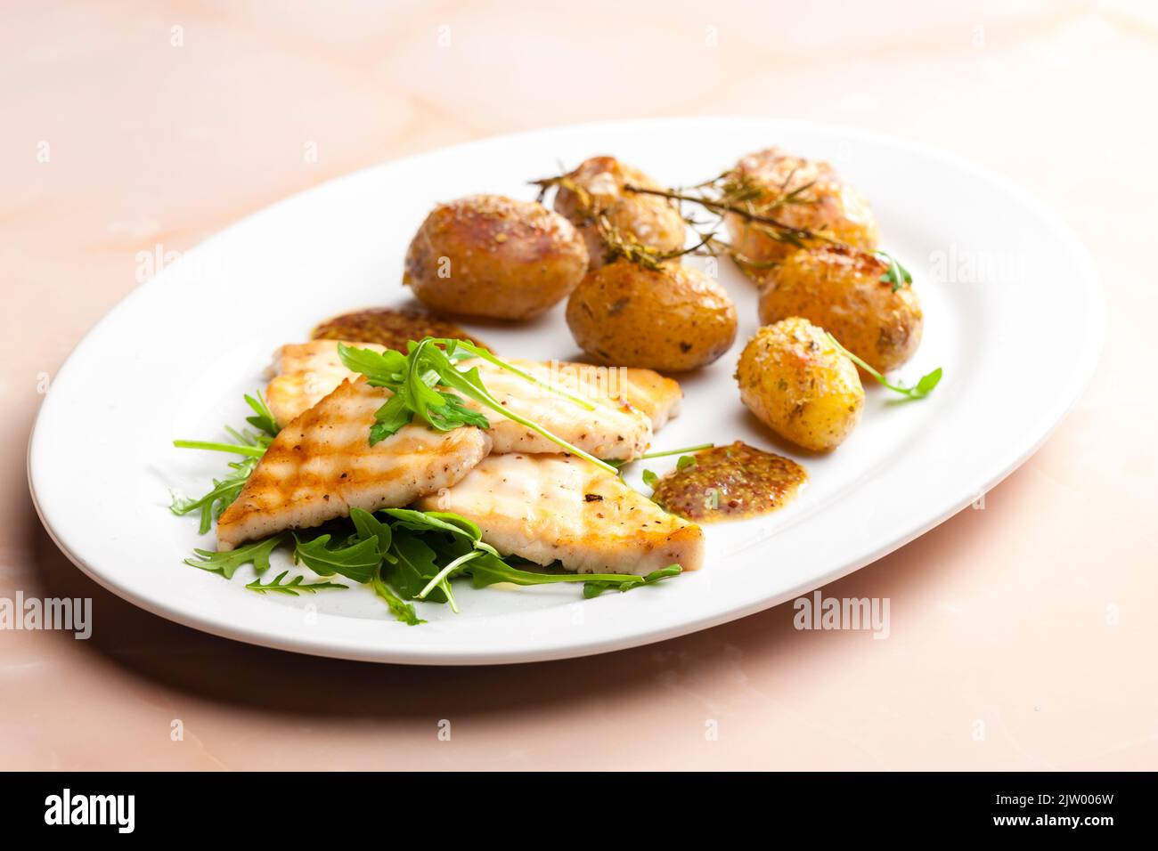 Still lifegrilled cod with potatoes Stock Photo - Alamy