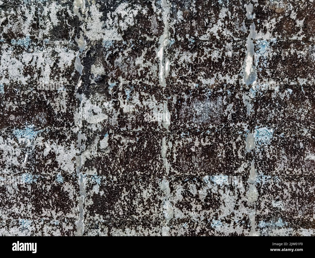 Dirty old eroded cracked plaster cement block fence. Concrete block ...