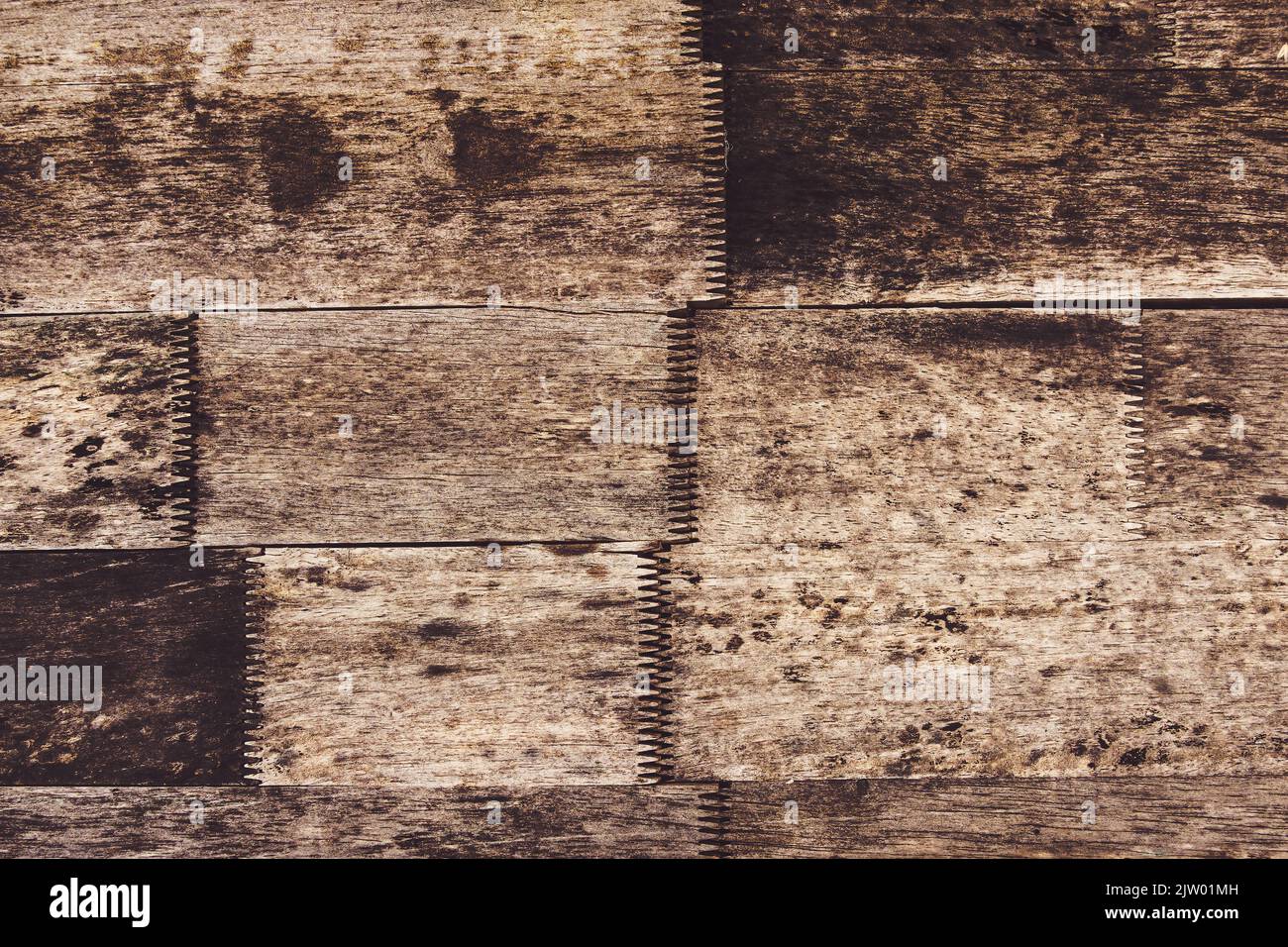 Close up to old dirty finger joint at end of wood sticks. Woodworking ...