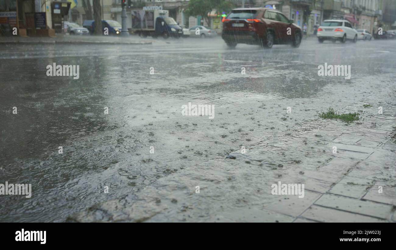 Odessa, Ukraine. 2nd Sep, 2022. Raindrops fall on the road with cars ...