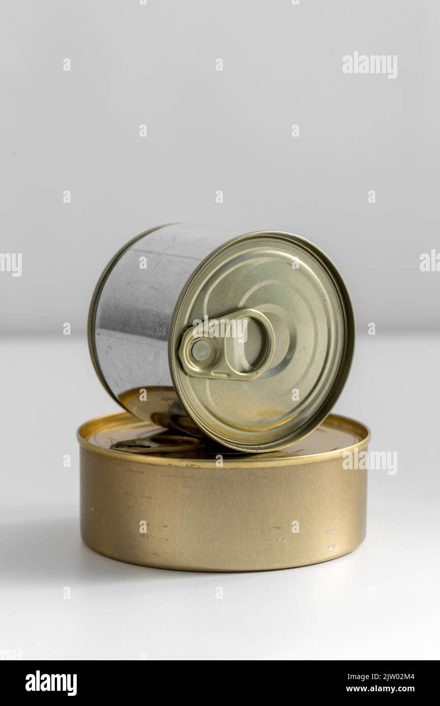 close up of tin cans with preserved food on table Stock Photo - Alamy