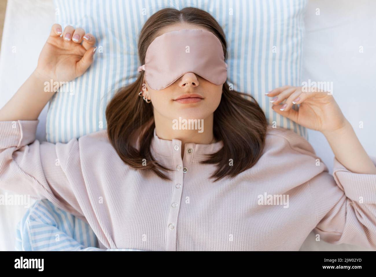 girl sleeping in eye mask in bed at home Stock Photo - Alamy