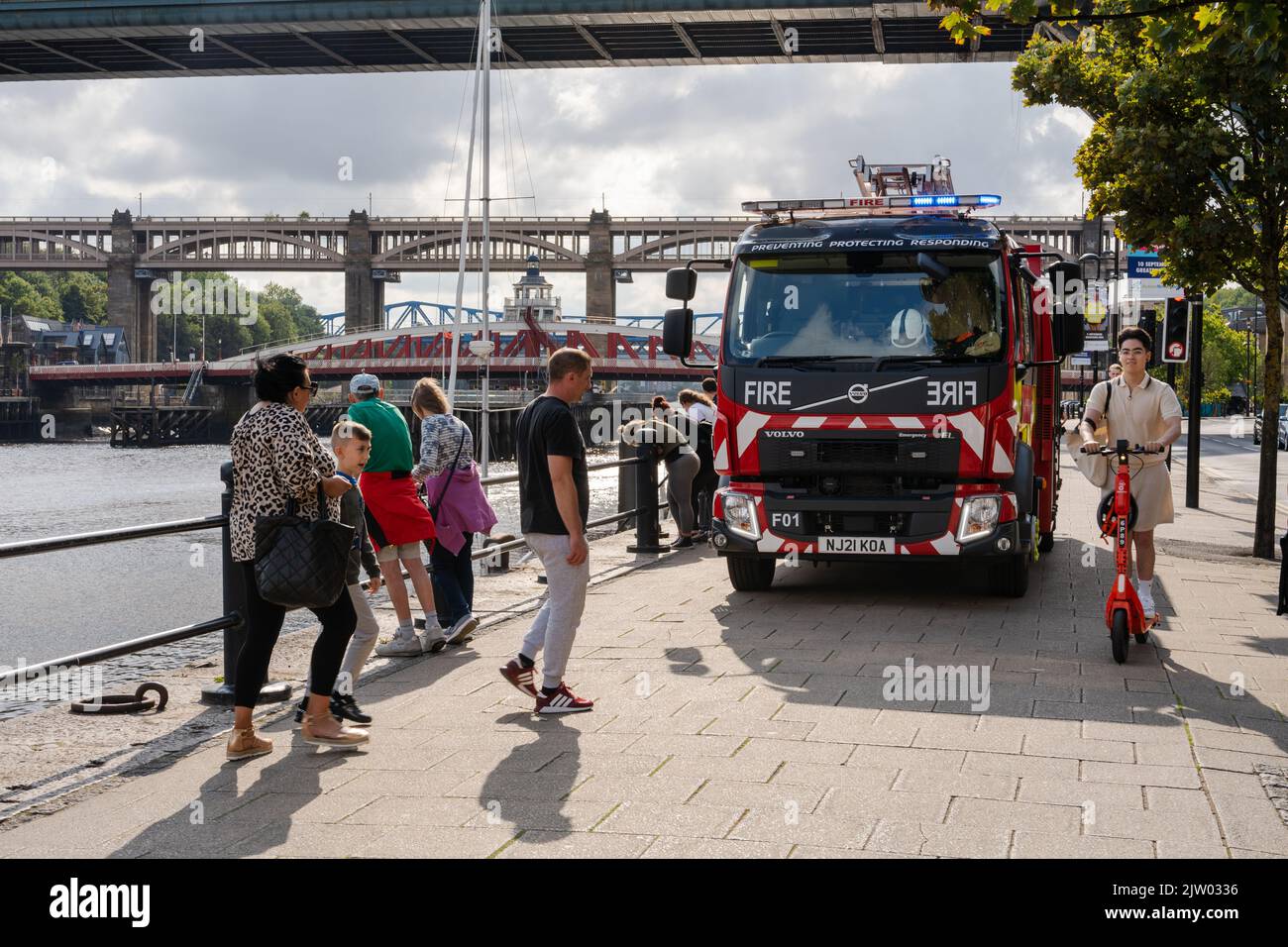 A fire engine and people on the Quayside underneath the Tyne Bridge in ...