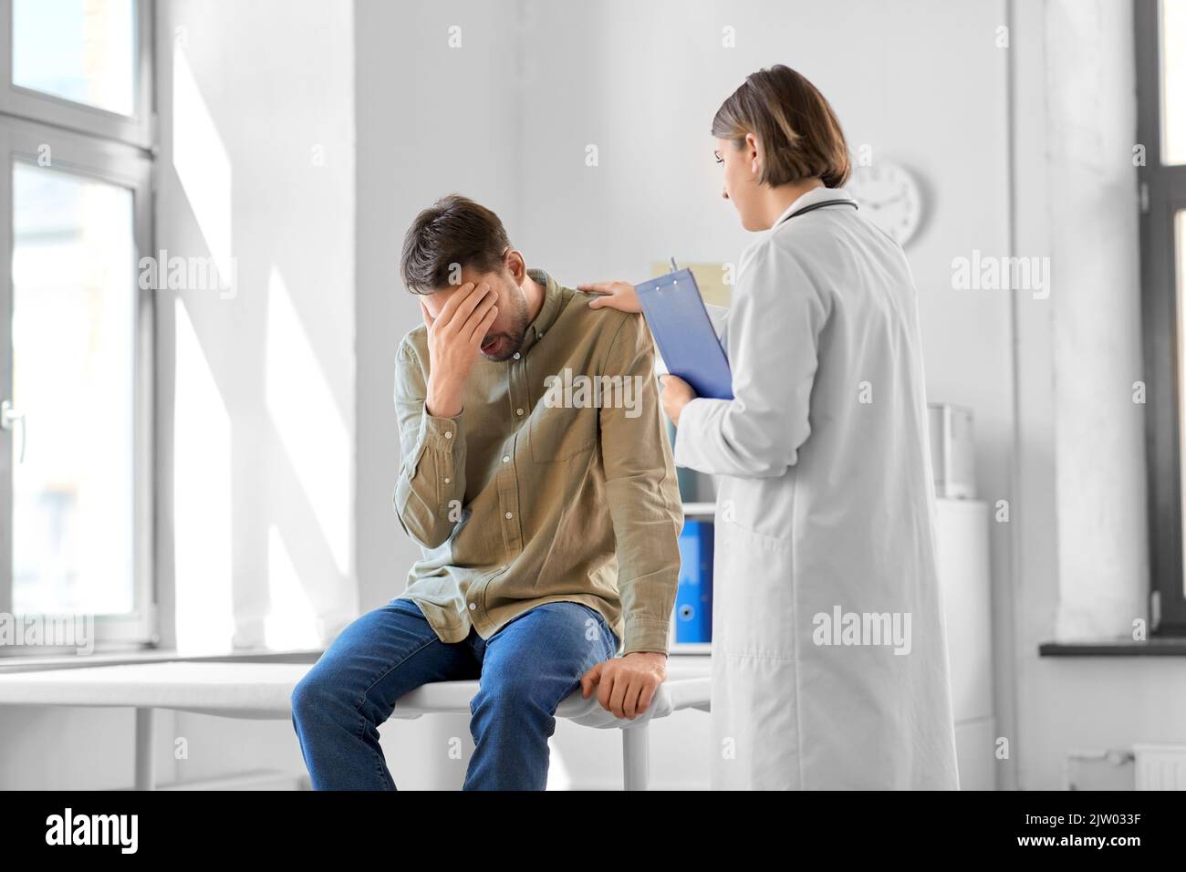 doctor and sad man with health problem at hospital Stock Photo - Alamy