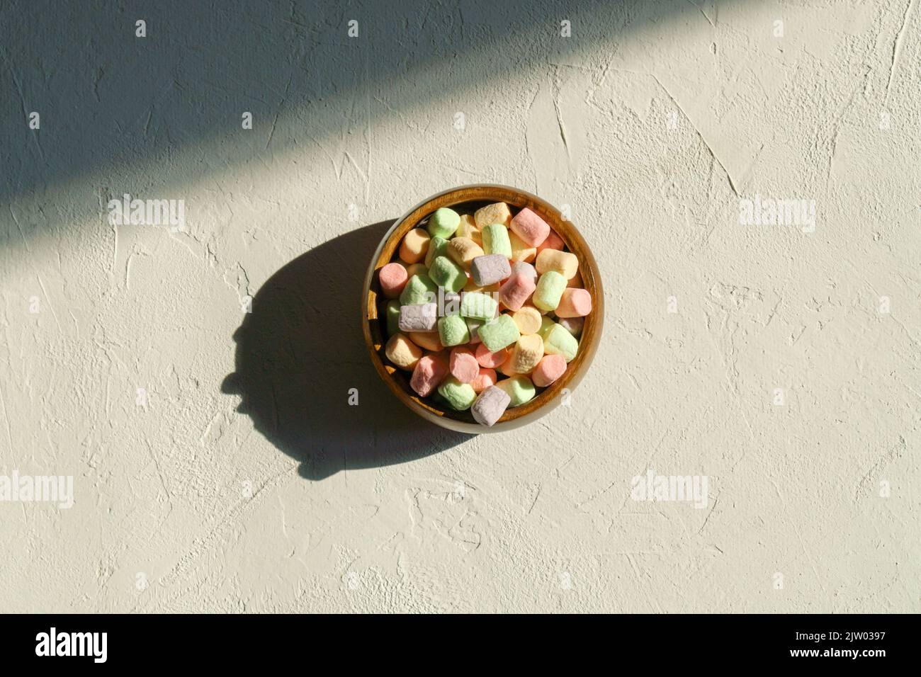 Multicolor marshmallow on lights white background. Top view. Solar ...