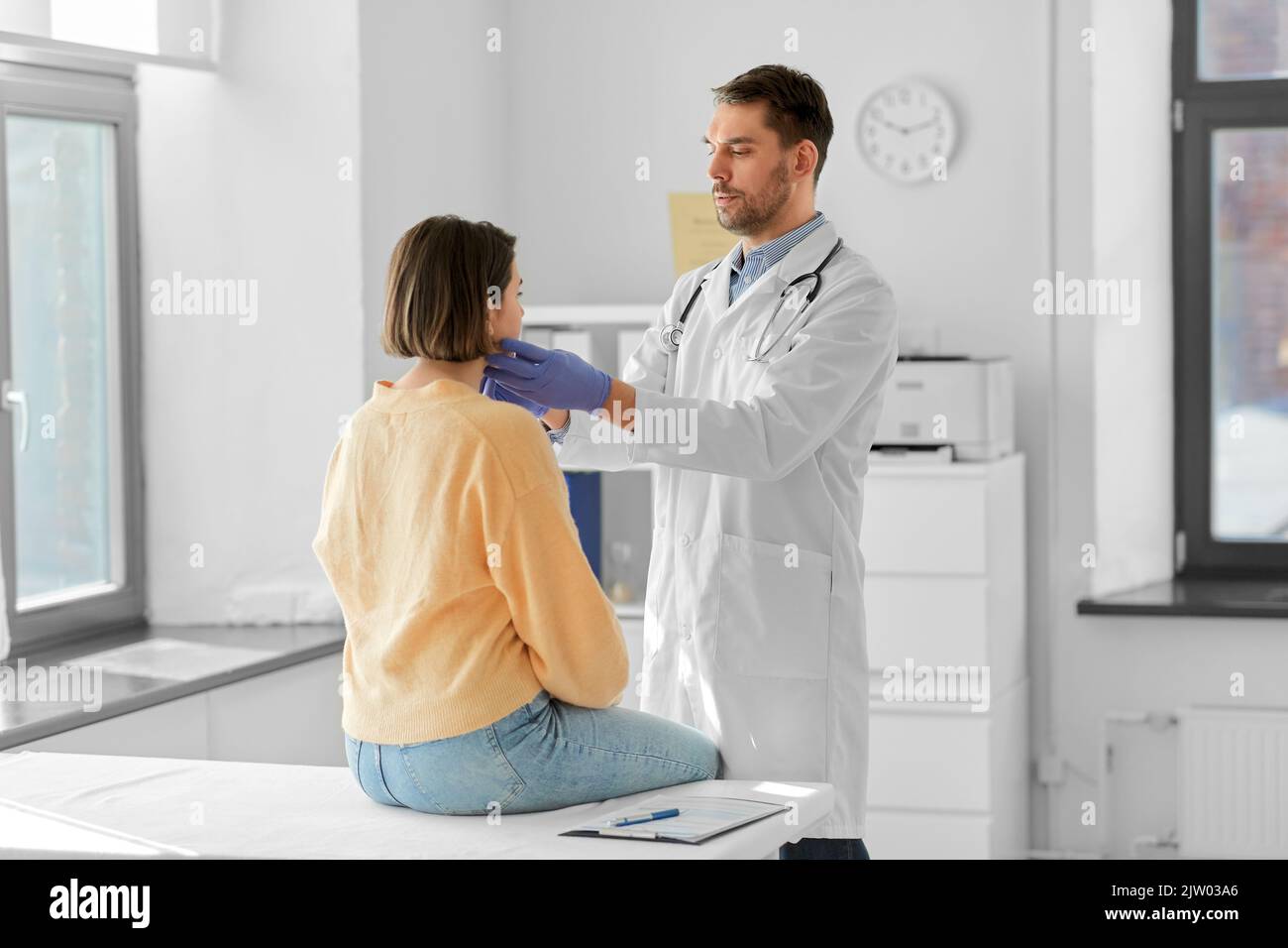 doctor checking lymph nodes of woman at hospital Stock Photo - Alamy