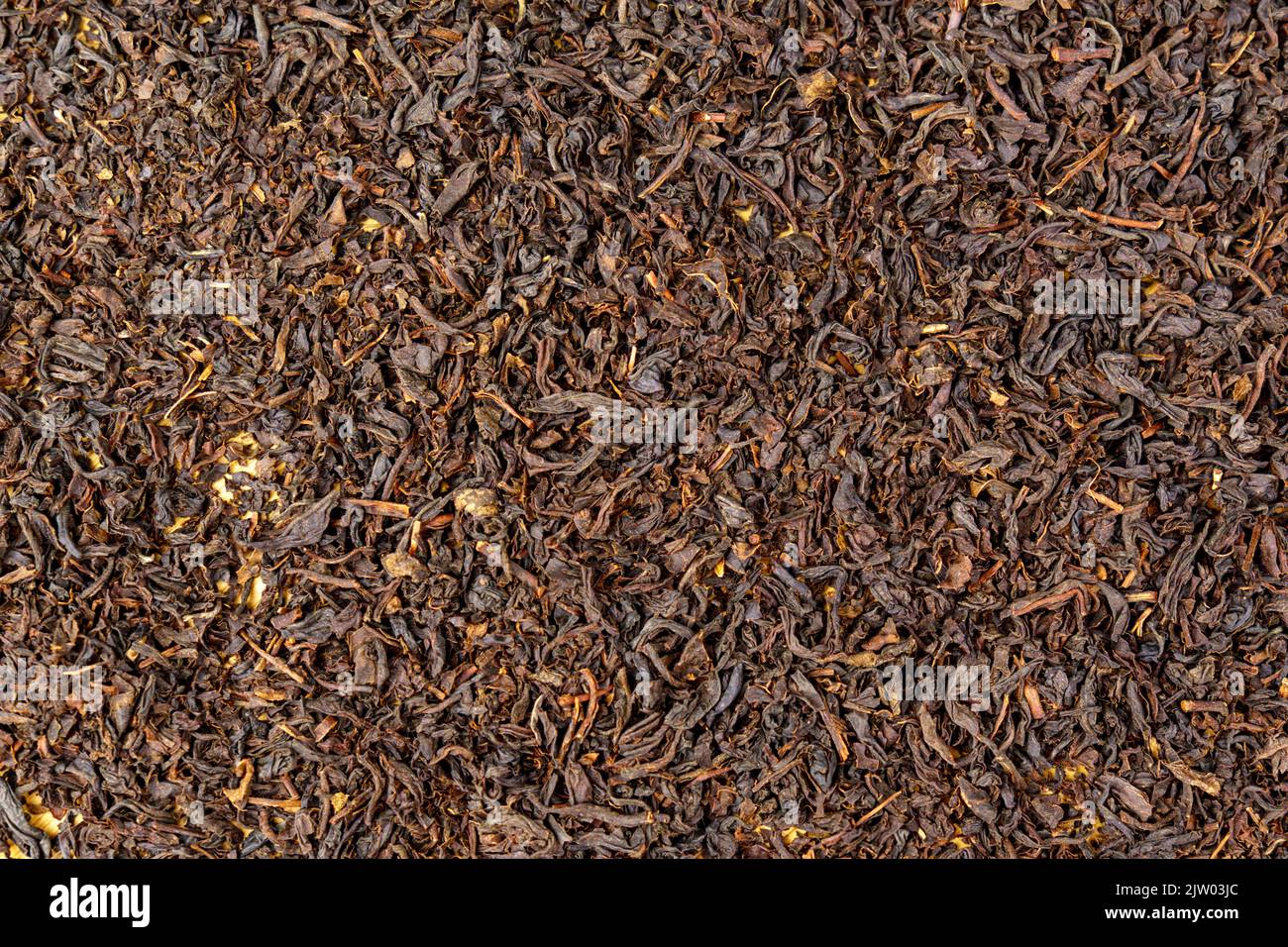 Dry black tea leaves close up. Dark background. Food and drink cooking ...