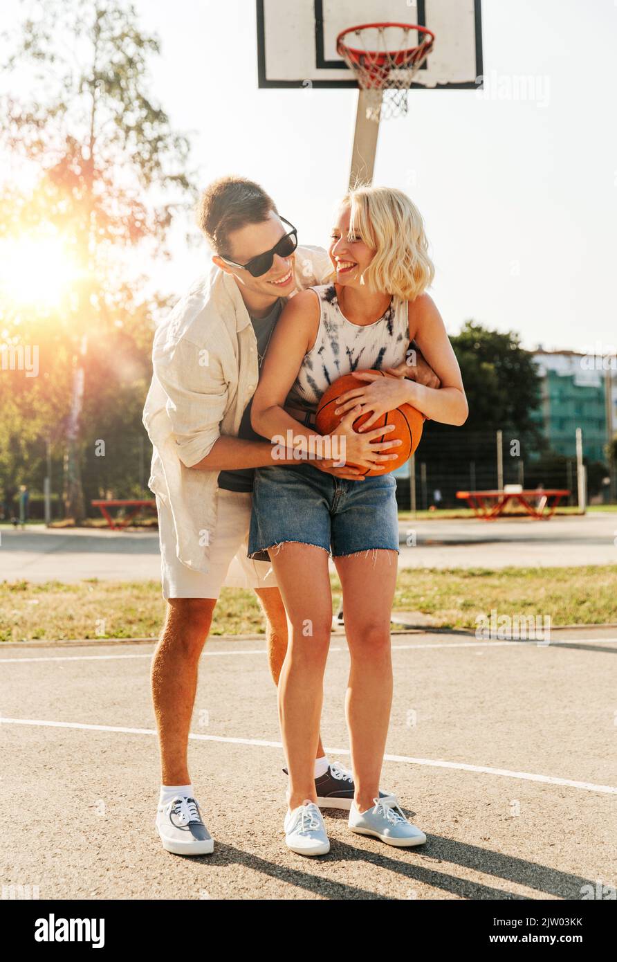 Young couple playing basketball on hi-res stock photography and images ...