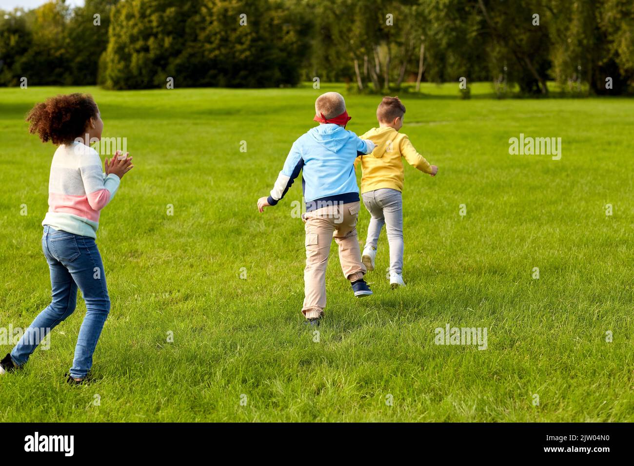 happy children playing and running at park Stock Photo - Alamy