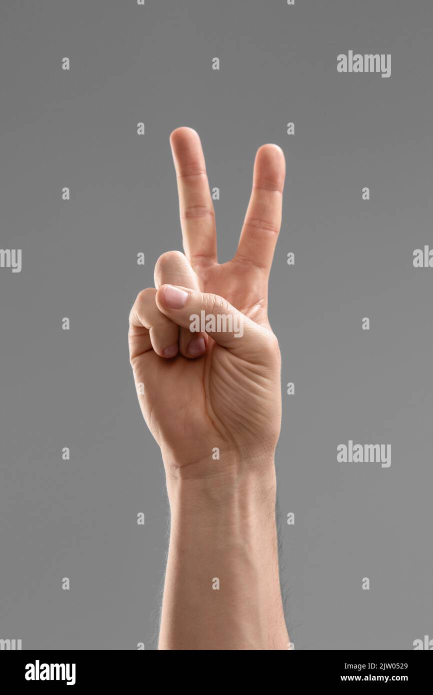 Showing peace gesture hi-res stock photography and images - Alamy