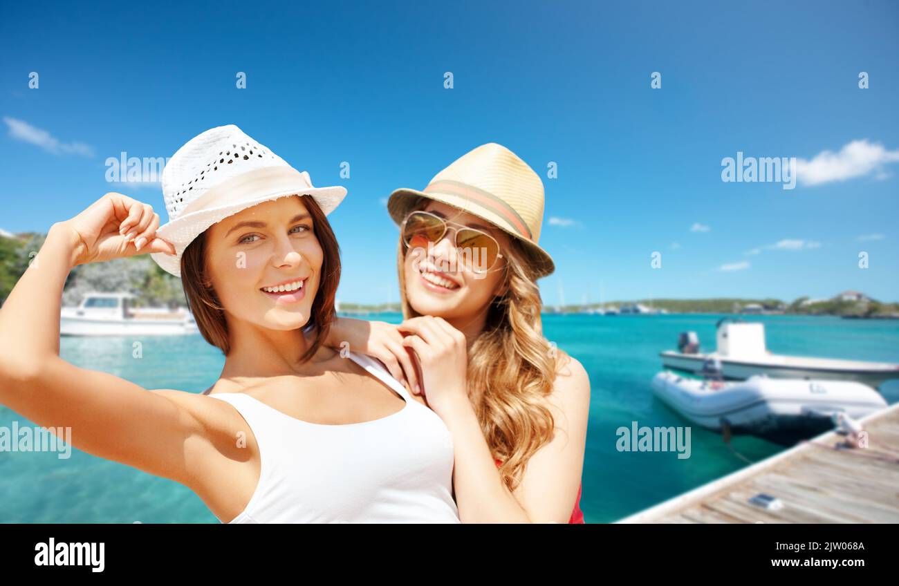 beautiful happy women in hats posing on beach Stock Photo - Alamy