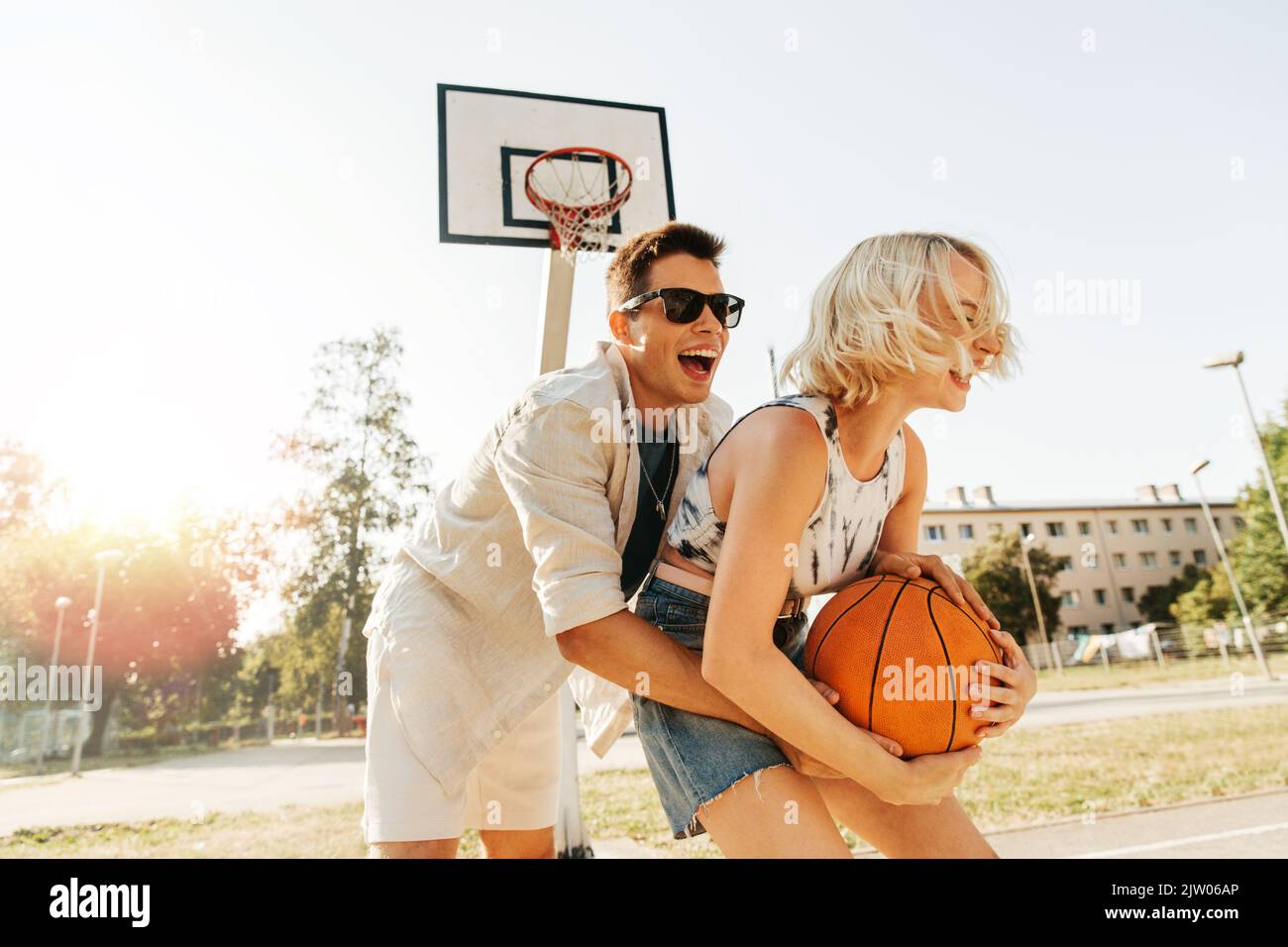 Young couple playing basketball on hi-res stock photography and images ...