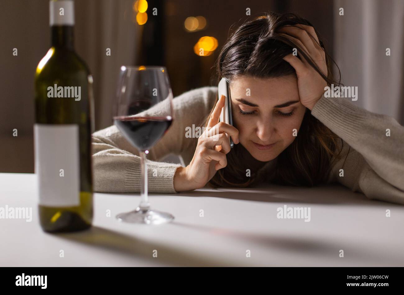 woman alcoholic drinking wine and calling on phone Stock Photo - Alamy