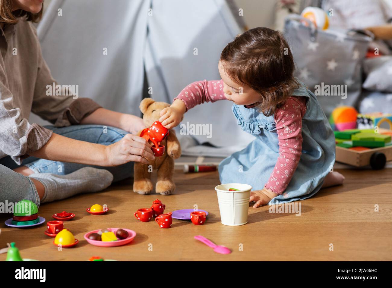 mother and daughter playing tea party at home Stock Photo - Alamy