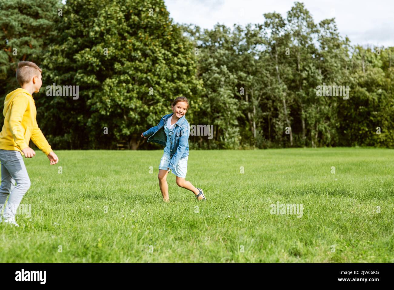 happy children playing and running at park Stock Photo - Alamy