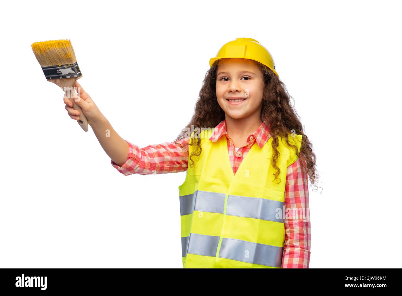 girl in helmet and safety vest with paint brush Stock Photo - Alamy
