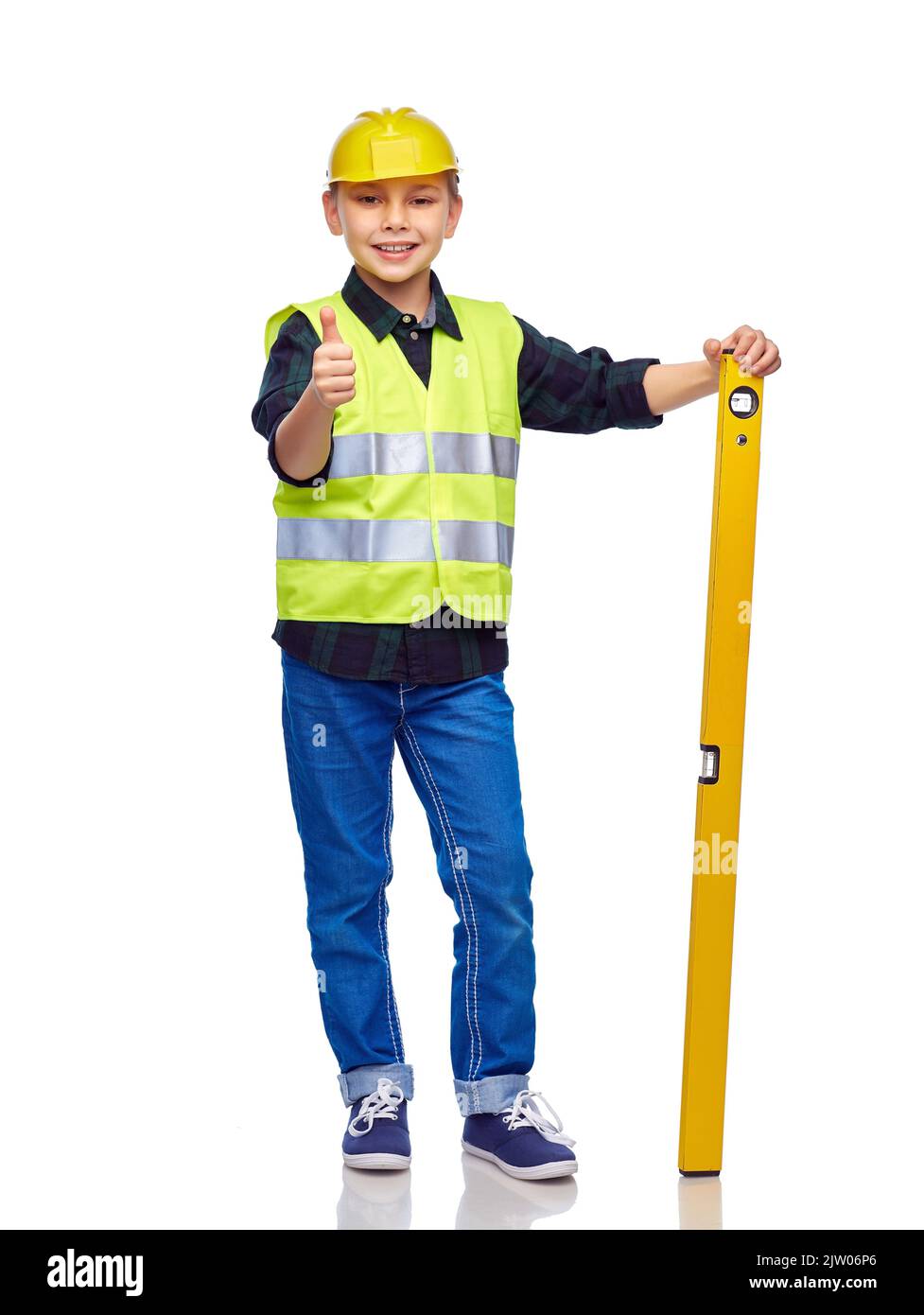boy in helmet with level showing thumbs up Stock Photo - Alamy