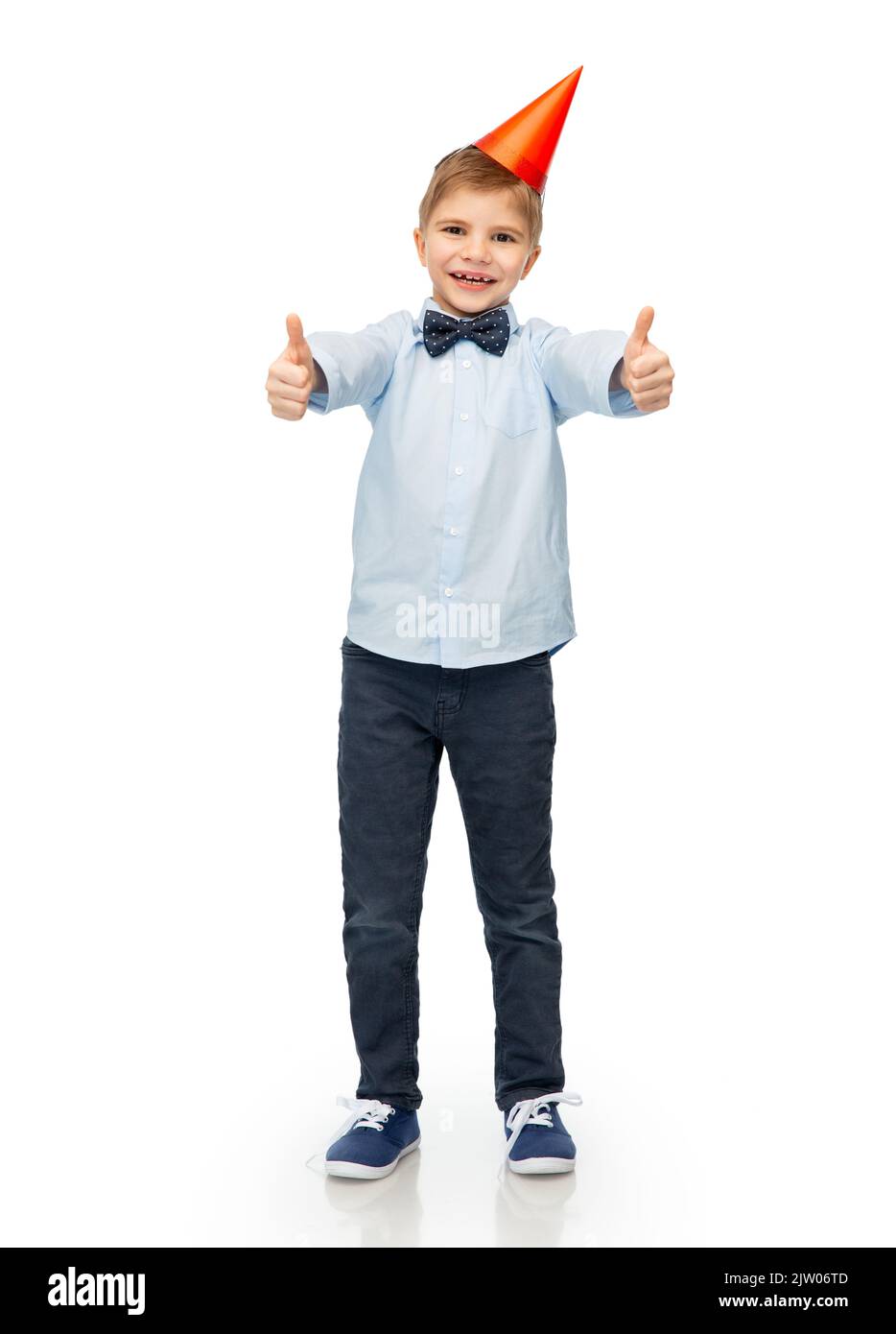 boy in birthday party hat showing thumbs up Stock Photo - Alamy
