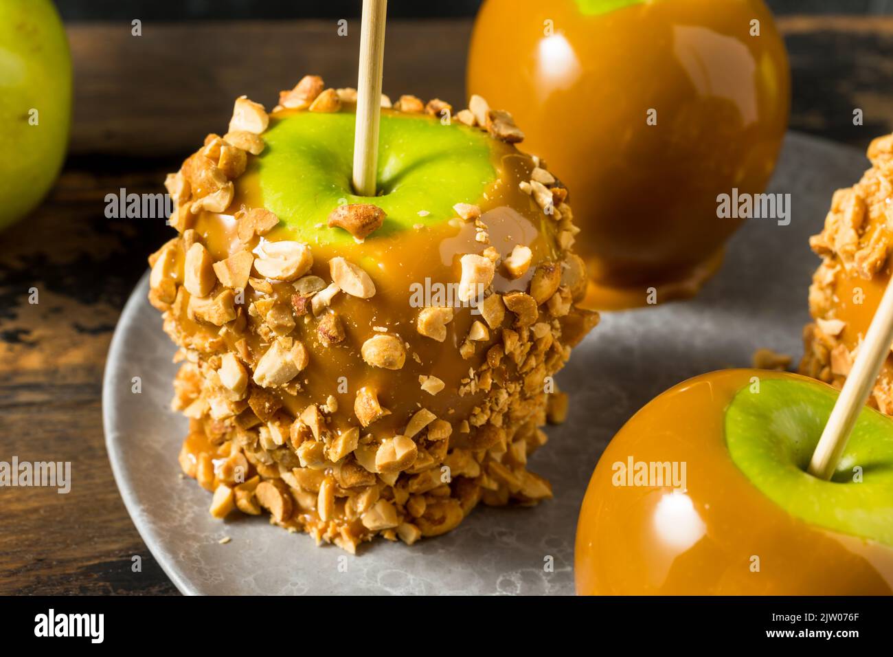 Homemade Halloween Candy Taffy Apples with Caramel and Peanuts Stock ...