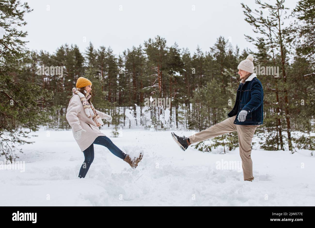 Couple playing in snow kicking hi-res stock photography and images - Alamy