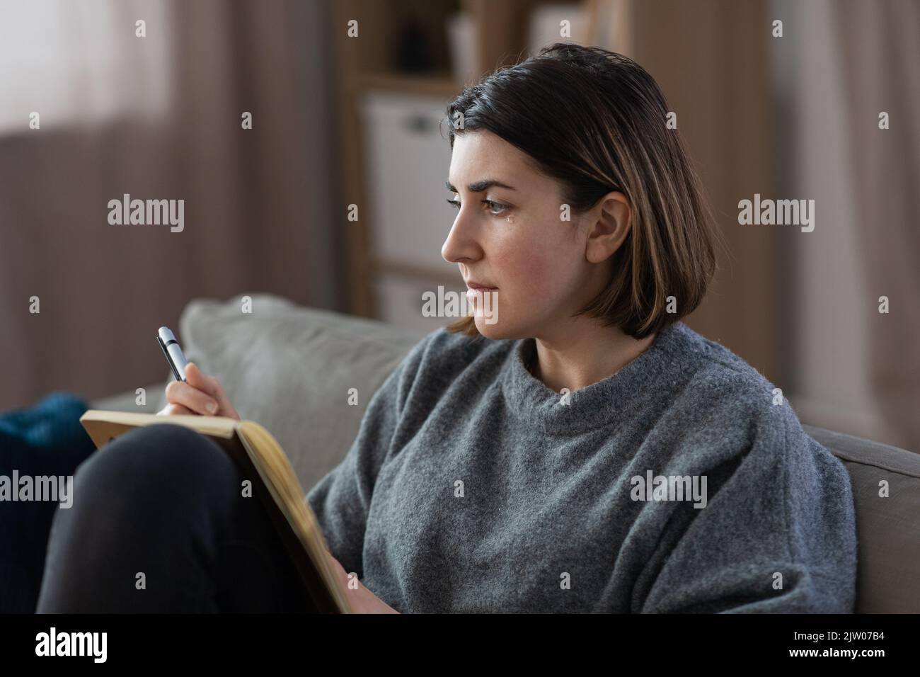 Person sad writing journal hi-res stock photography and images - Alamy
