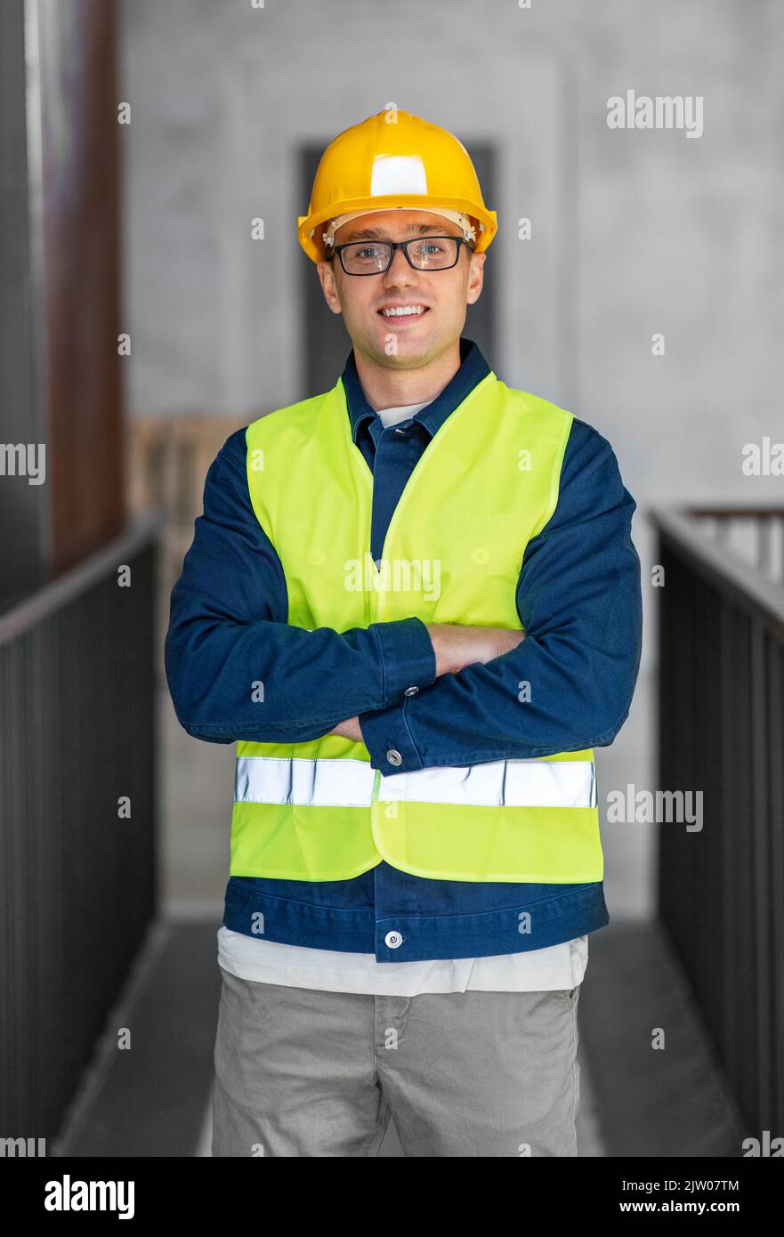 male architect in helmet and safety west at office Stock Photo - Alamy