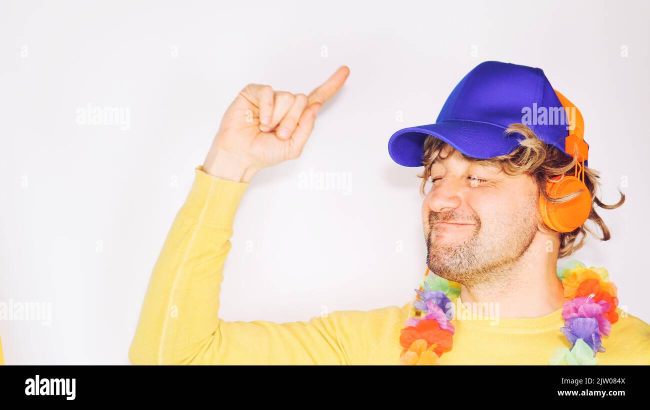 Expressive man listening to music making exciting gesture, isolated on ...