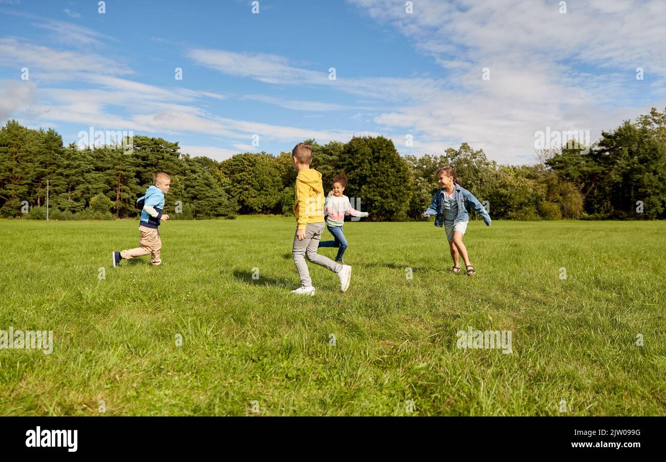 Children running field multiethnic hi-res stock photography and images ...