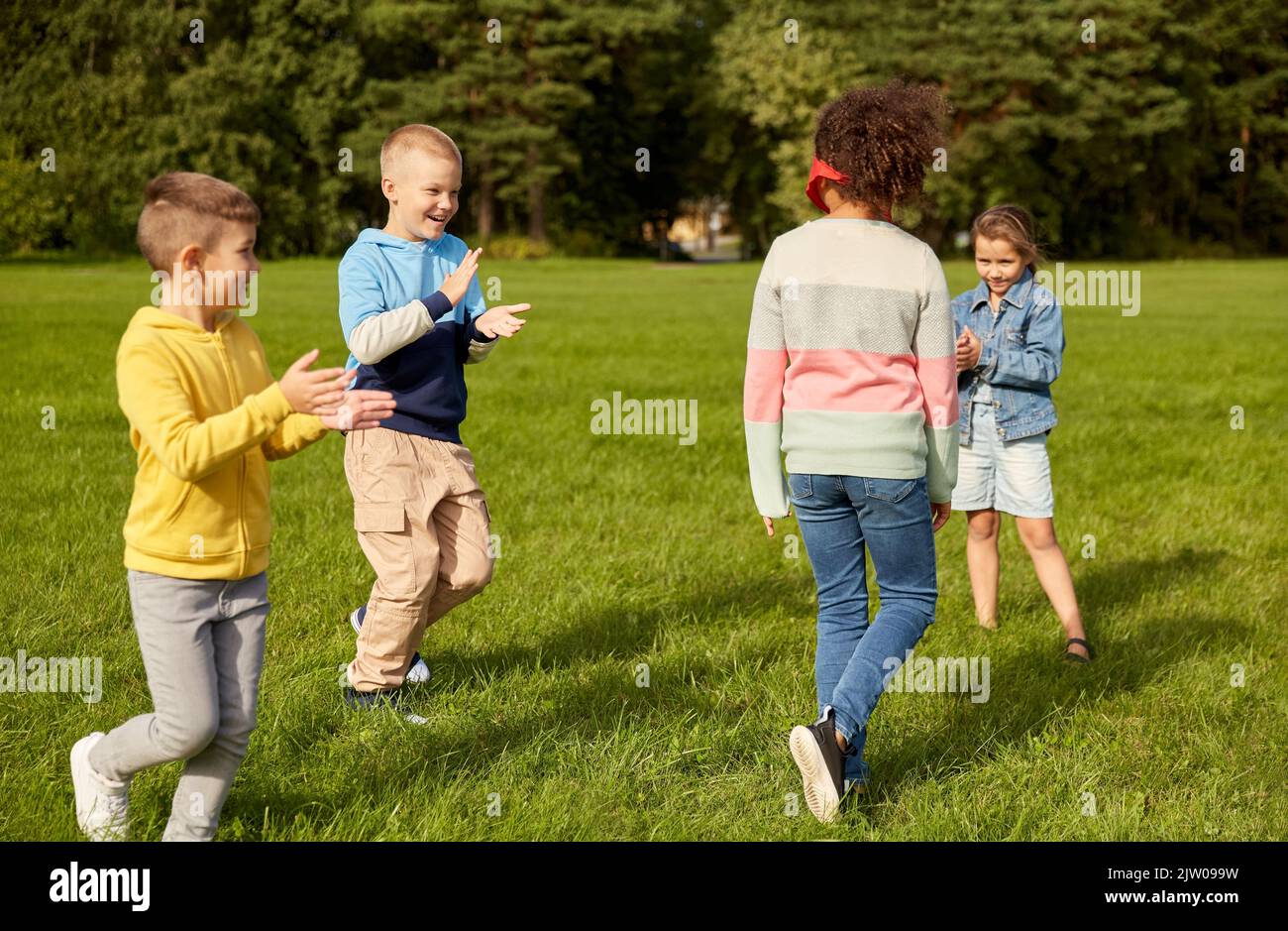 happy children playing and running at park Stock Photo - Alamy