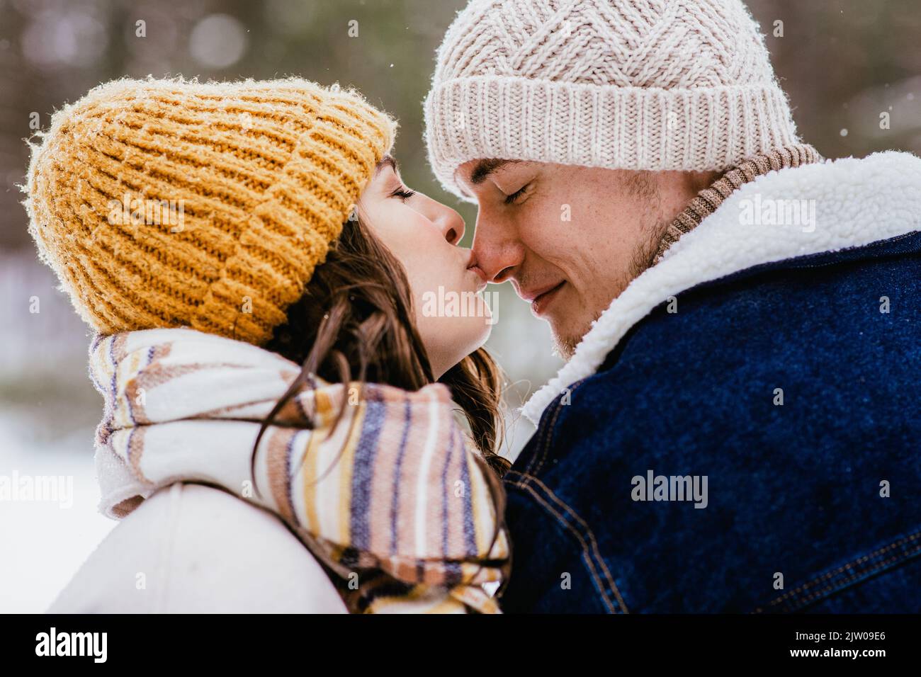 Woman kissing nose hi-res stock photography and images - Alamy